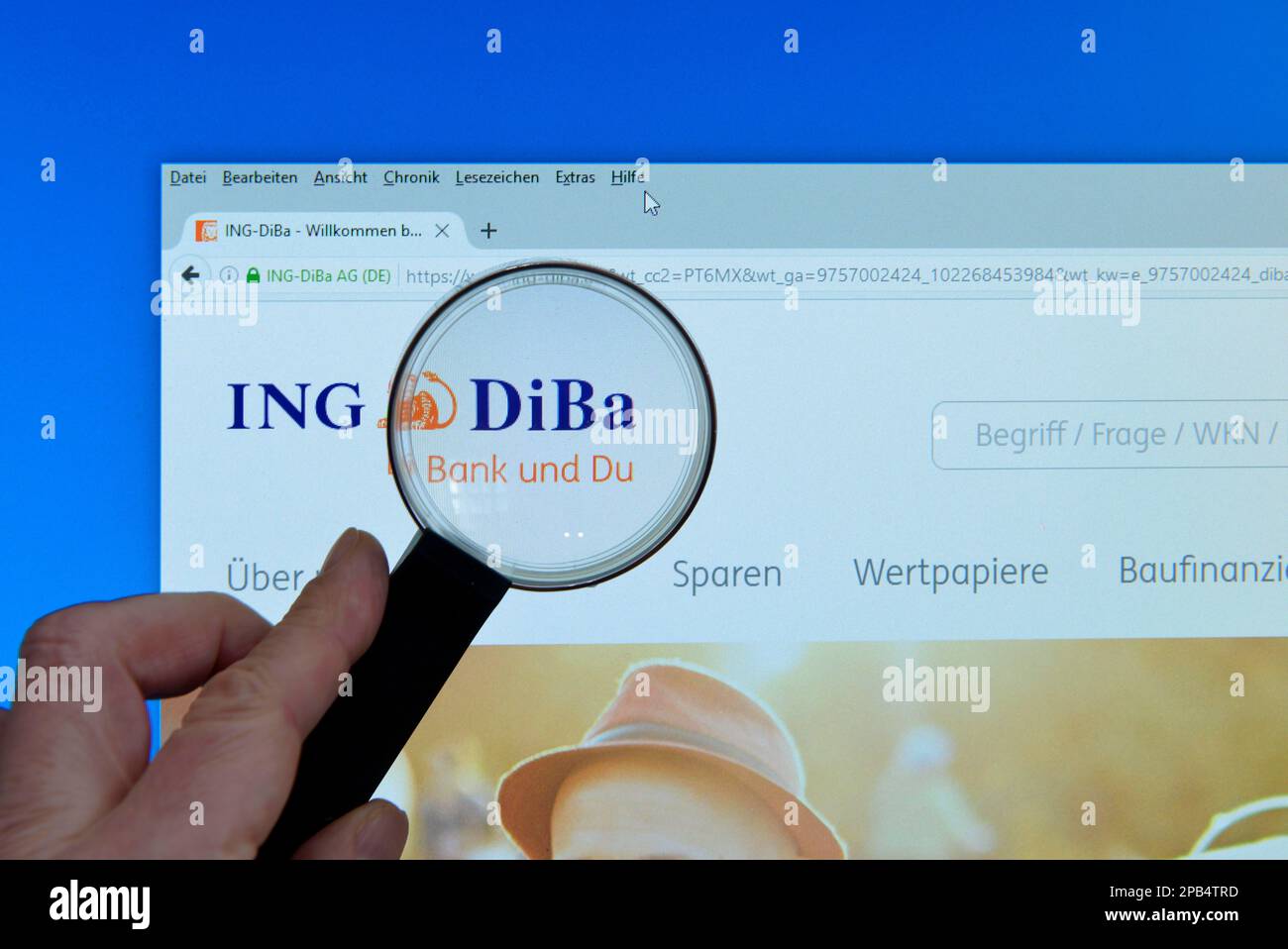 ING Diba, website, internet, screen, magnifying glass, hand Stock Photo ...