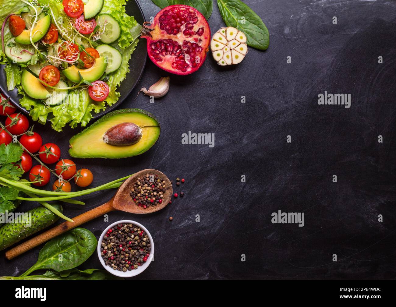 Ingredients for making salad on rustic black chalk board background ...