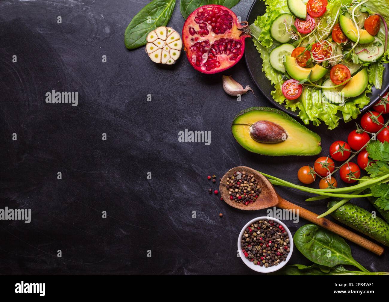 Ingredients for making salad on rustic black chalk board background ...