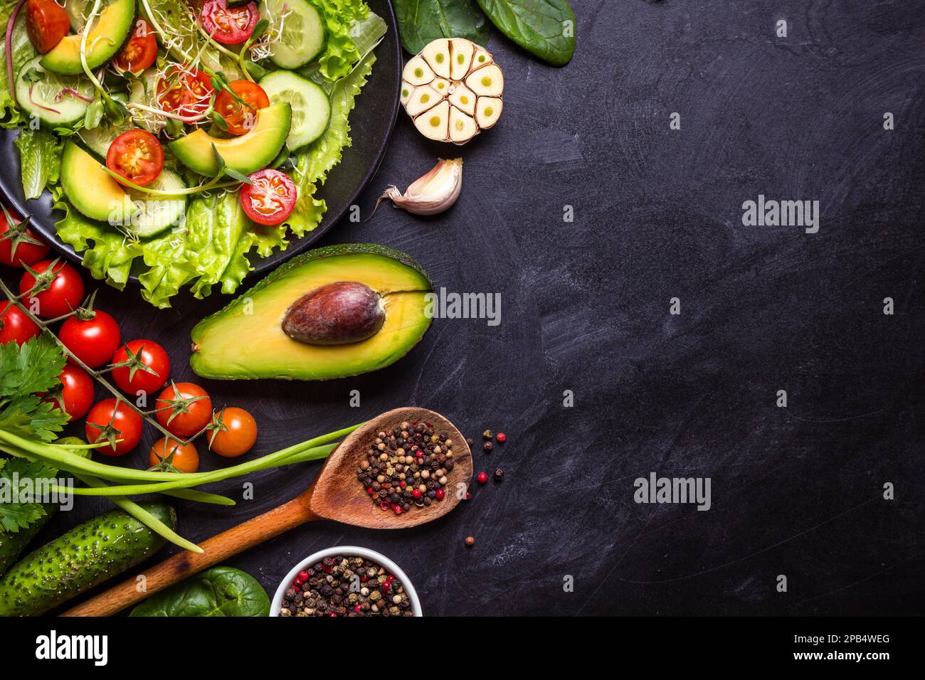 Ingredients for making salad on rustic black chalk board background ...