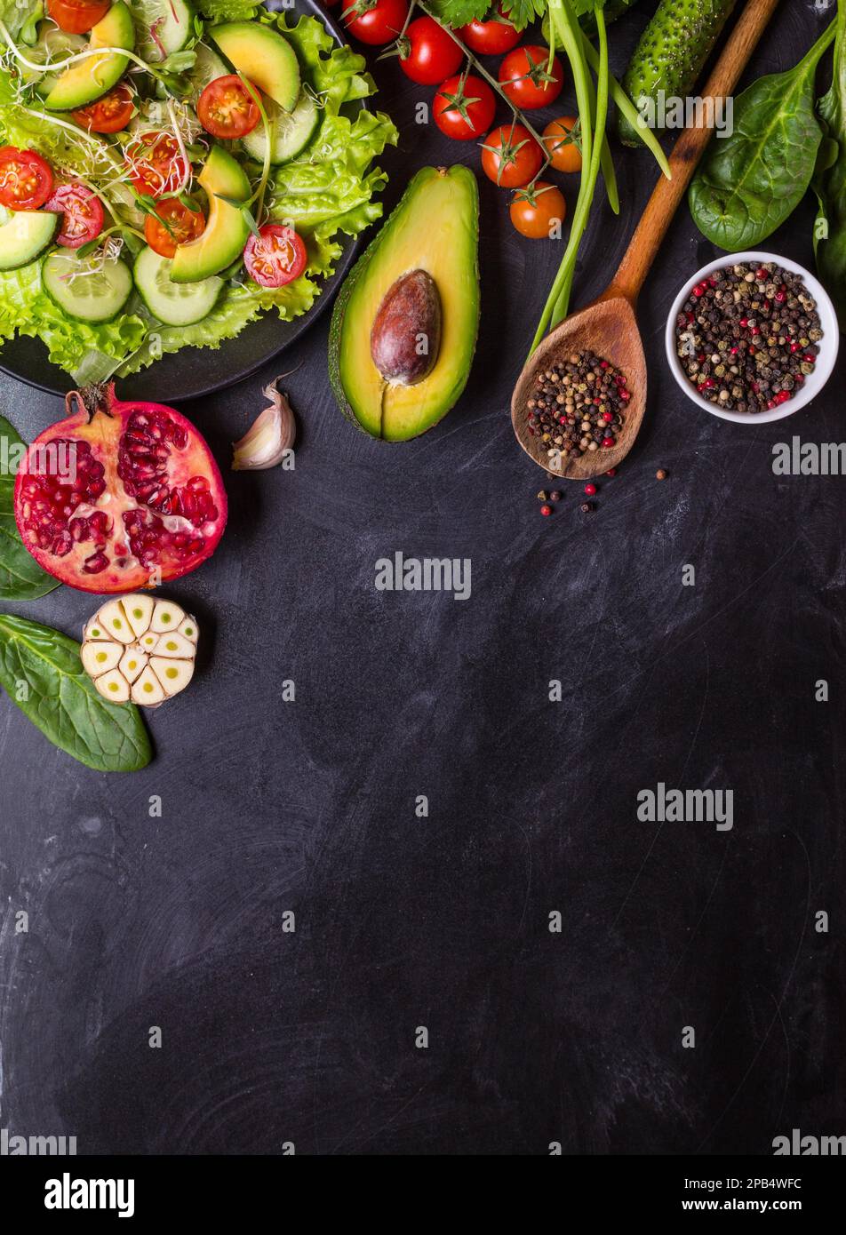 Ingredients for making salad on rustic black chalk board background ...