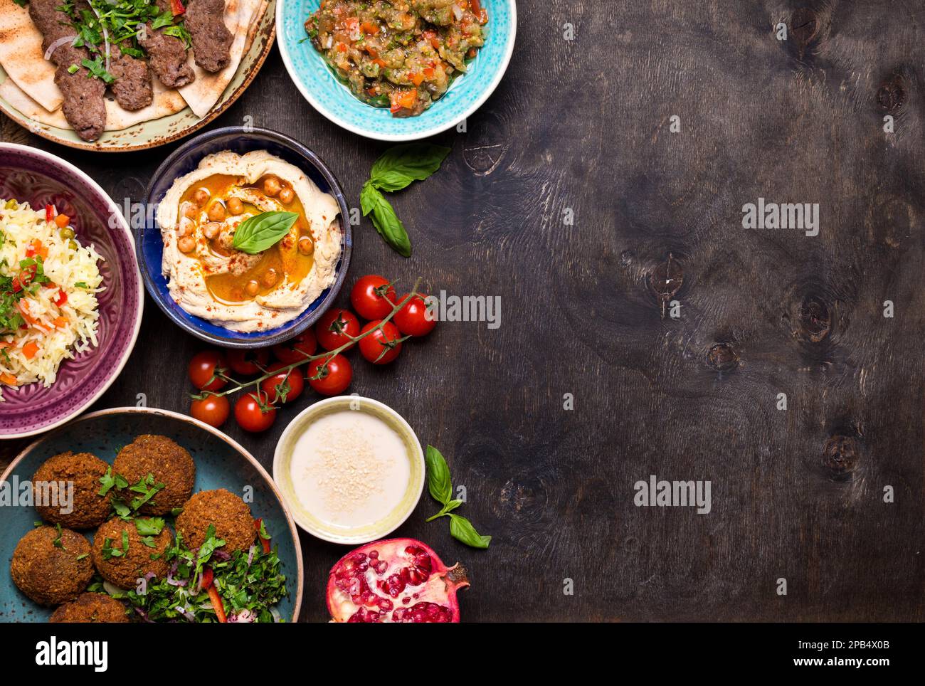 Middle eastern or arabic dishes and assorted meze on a dark background ...