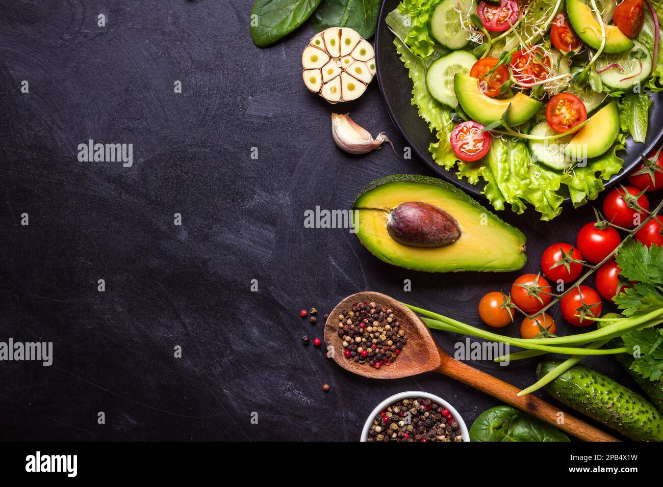 Ingredients for making salad on rustic black chalk board background ...