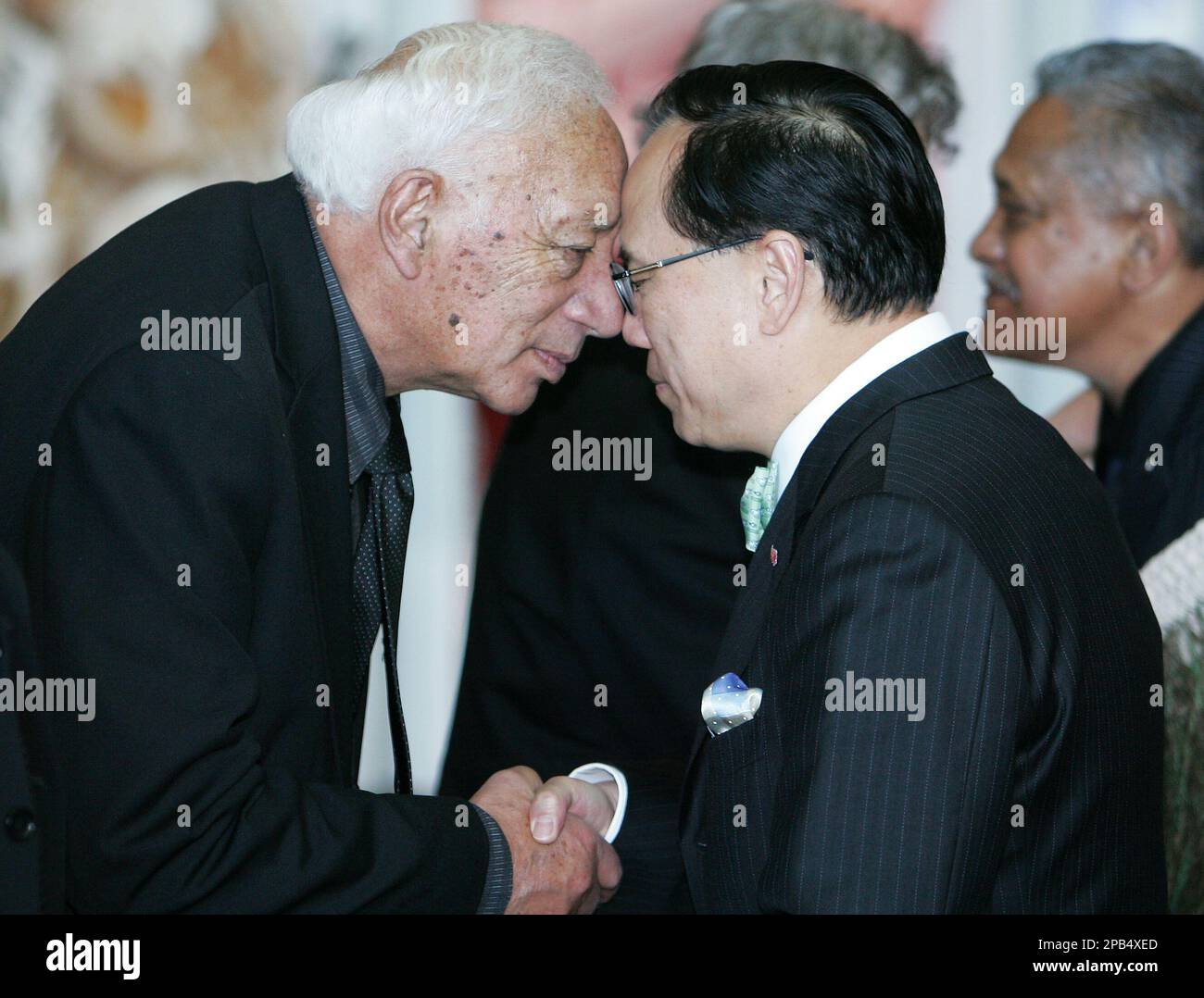 Hong Kong leader Donald Tsang, right, hongis (ceremonial touching of ...