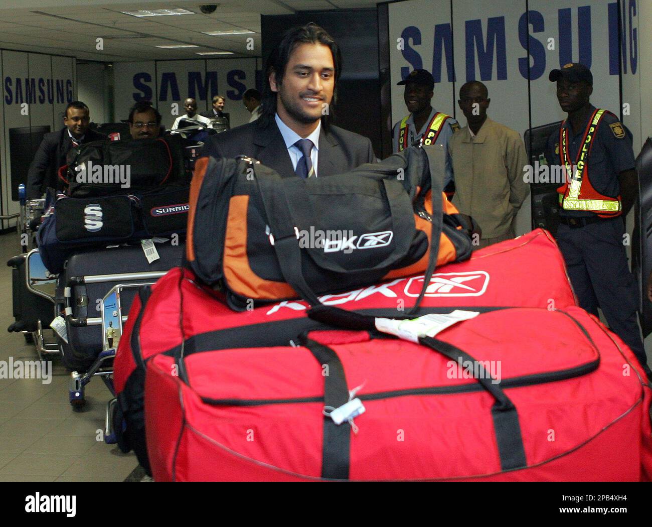 India's captain Mahendra Dhoni, and fellow team members arrive for the ...
