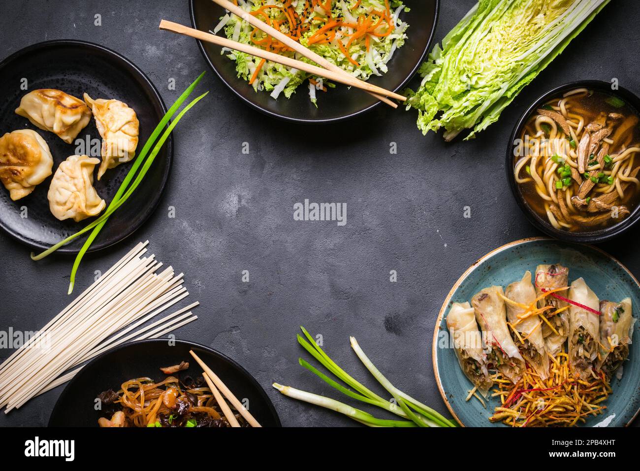 Chinese food dark background. Chinese noodles, fried rice, noodle soup ...