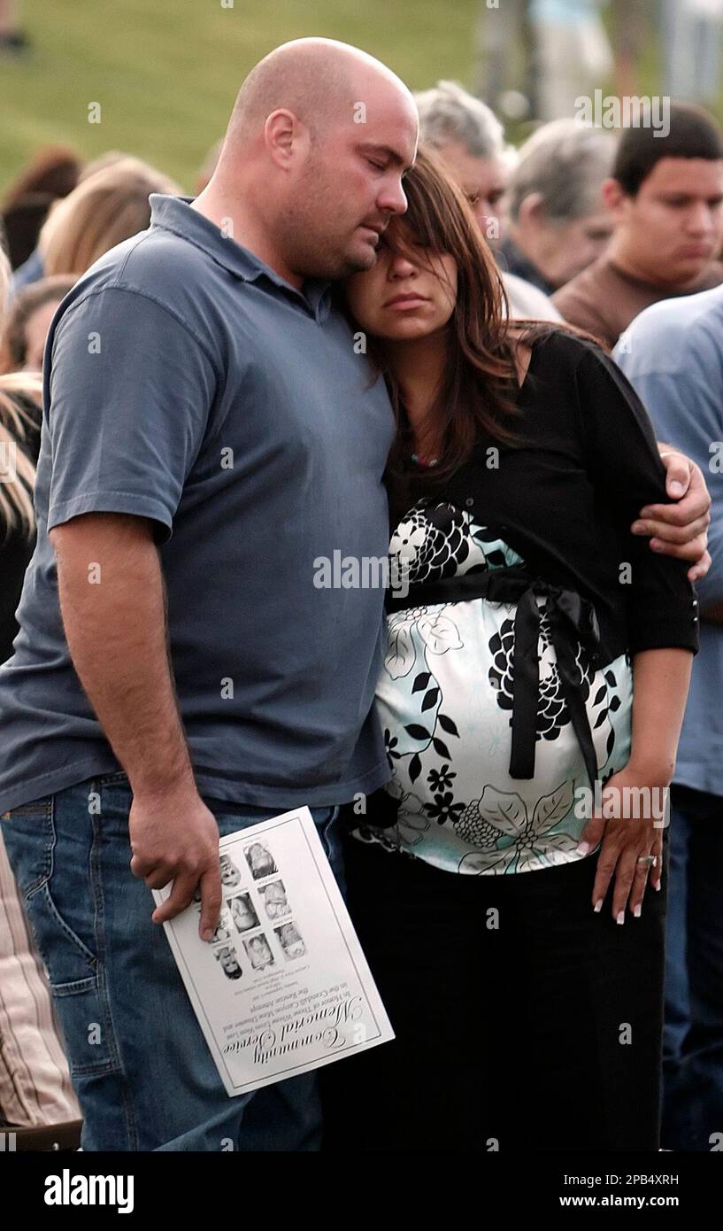 Mike Marasco, right, hugs his wife Tifany Marasco during a memorial ...