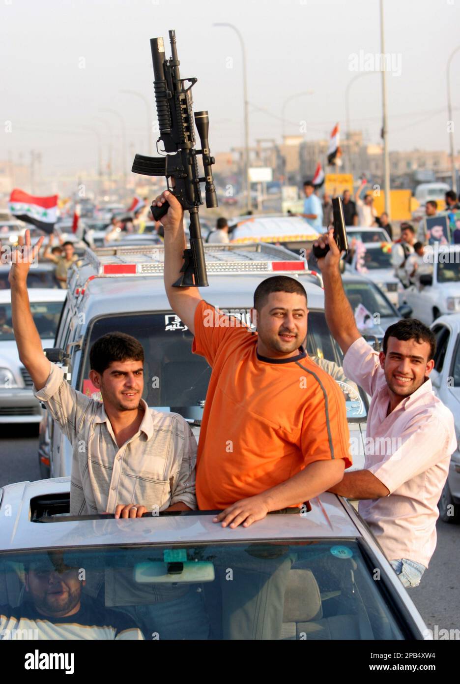 ** FILE ** Mahdi Army militiamen celebrate the withdrawal of British ...