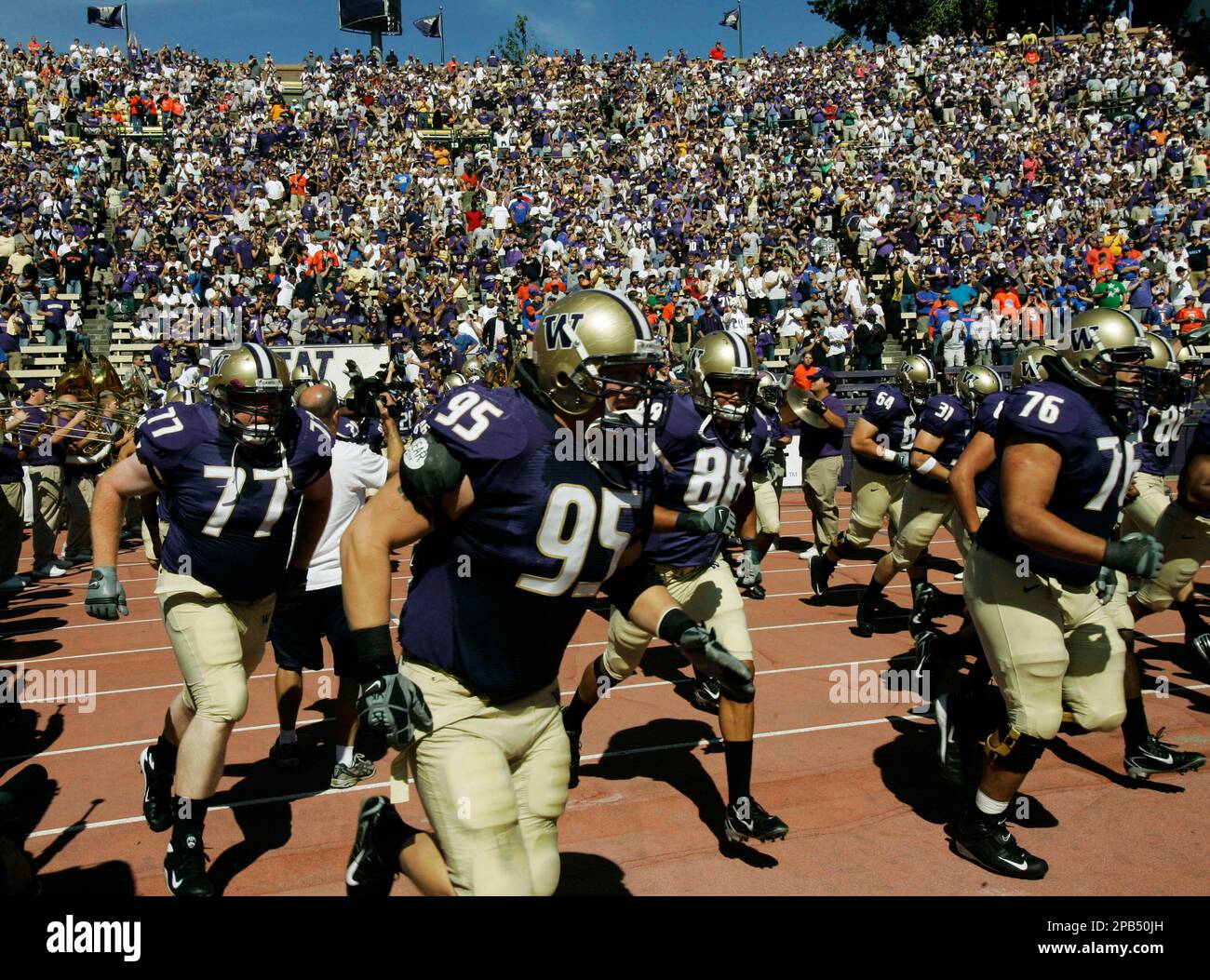 Washington college football players, from left, Erick Lobos (77 ...
