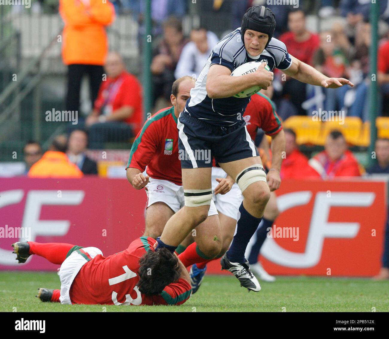 Scotland's Simon Taylor is tackled by Portugal's Federico Sousa during ...