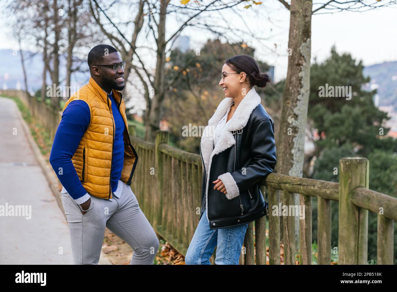 Lifestyle Bliss: Casual Black Boy and Caucasian Girl Chat Happily ...