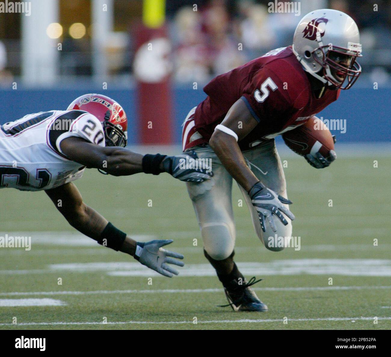Washington State wide receiver Michael Bumpus, right, breaks the ...