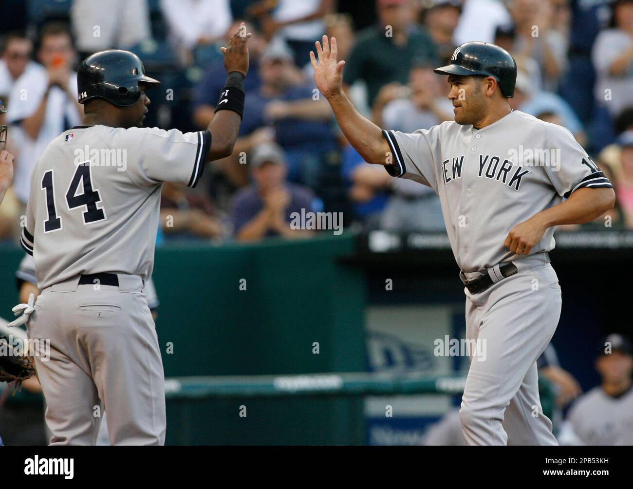 New York Yankees' Johnny Damon, right, celebrates his two-run home run ...
