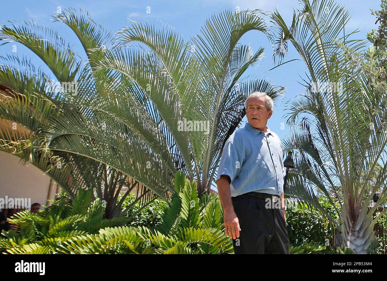 President Bush arrives to make a statement to reporters at Hickam Air ...