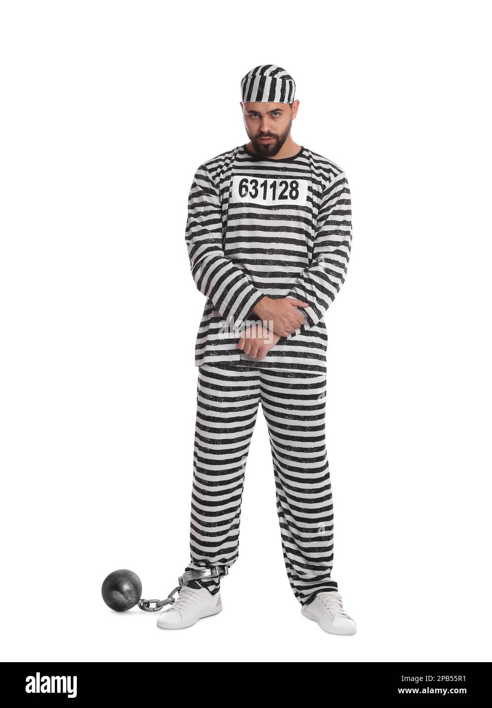 Prisoner in special uniform with metal ball on white background Stock ...