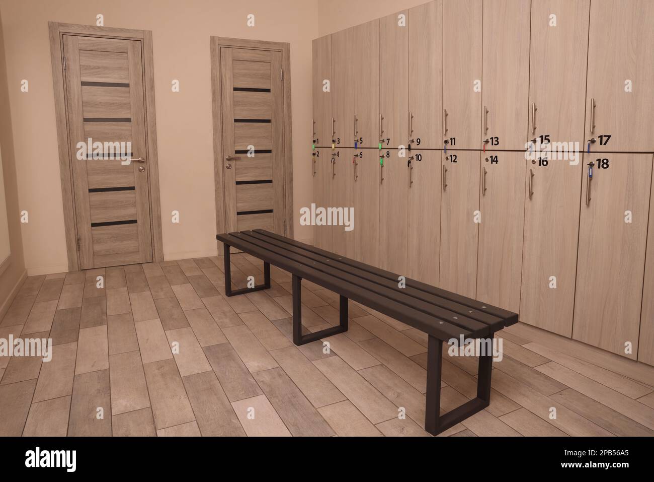 Wooden bench and lockers in changing room interior Stock Photo - Alamy