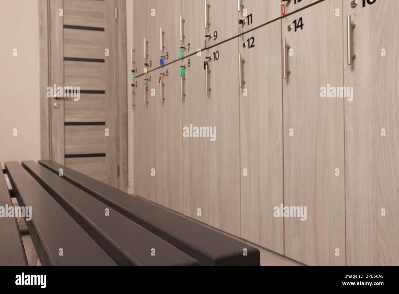 Wooden bench near lockers in changing room Stock Photo - Alamy
