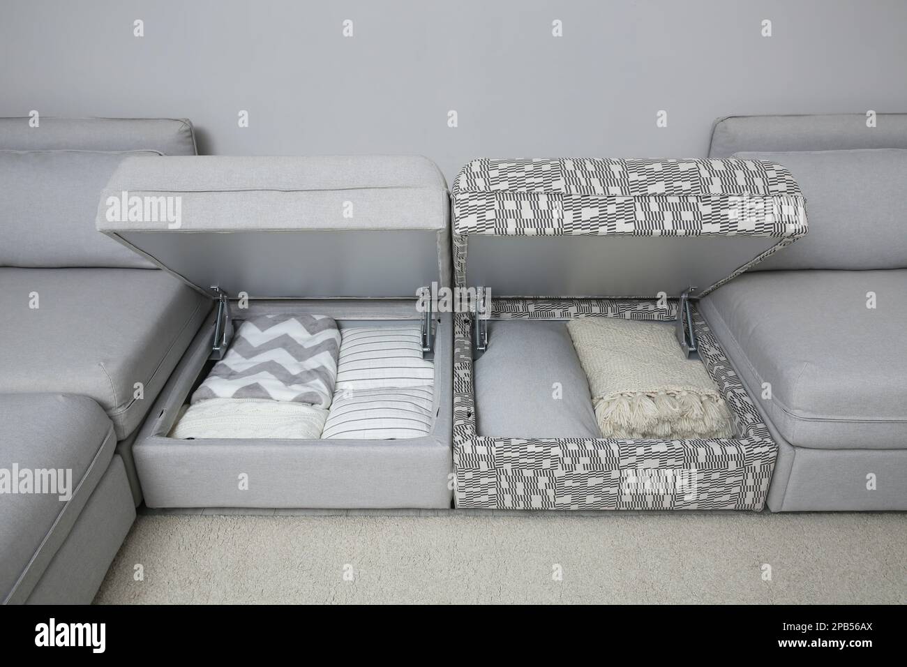 Modular sofa with storage near wall in living room. Interior design ...