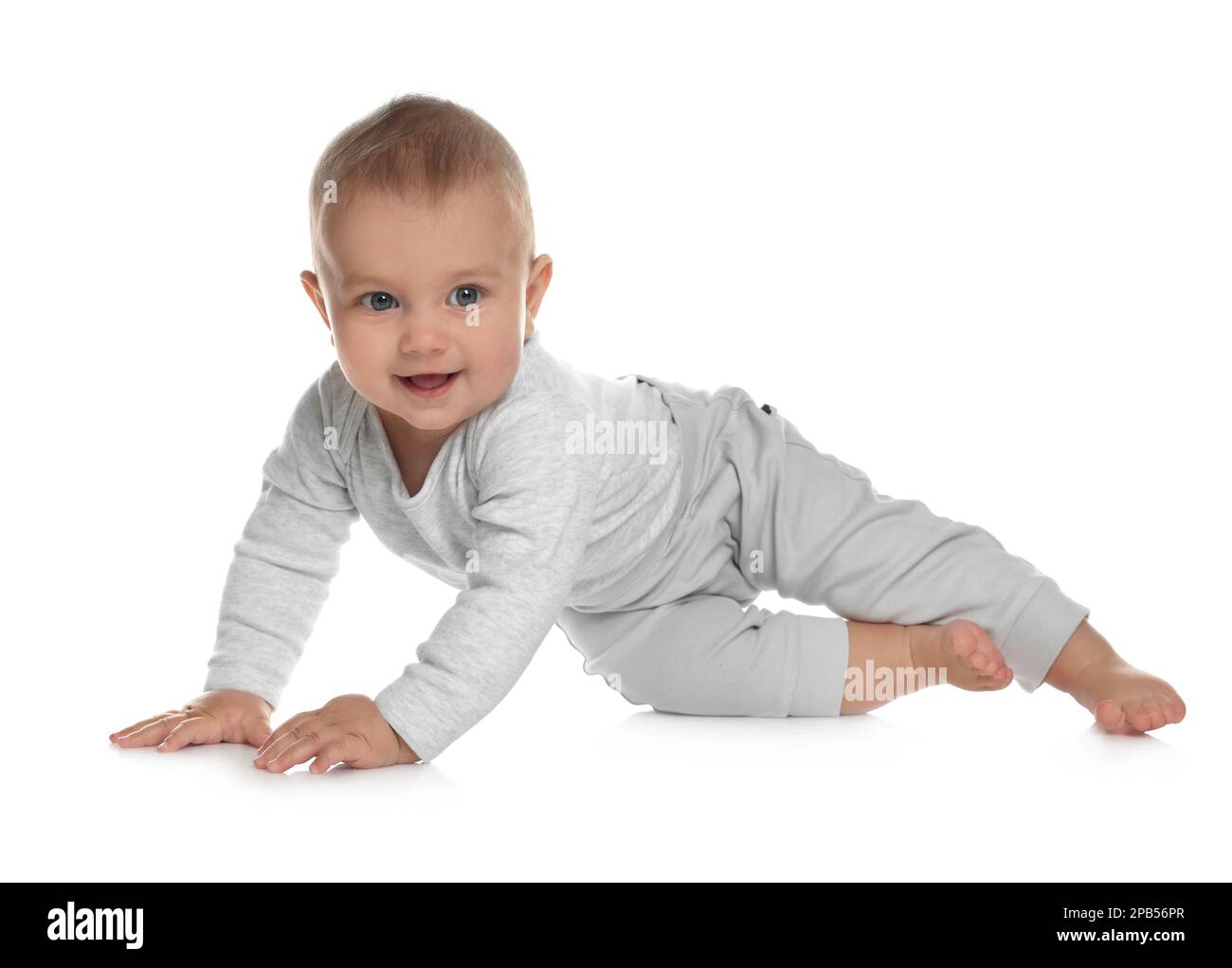 Cute little baby crawling on white background Stock Photo - Alamy