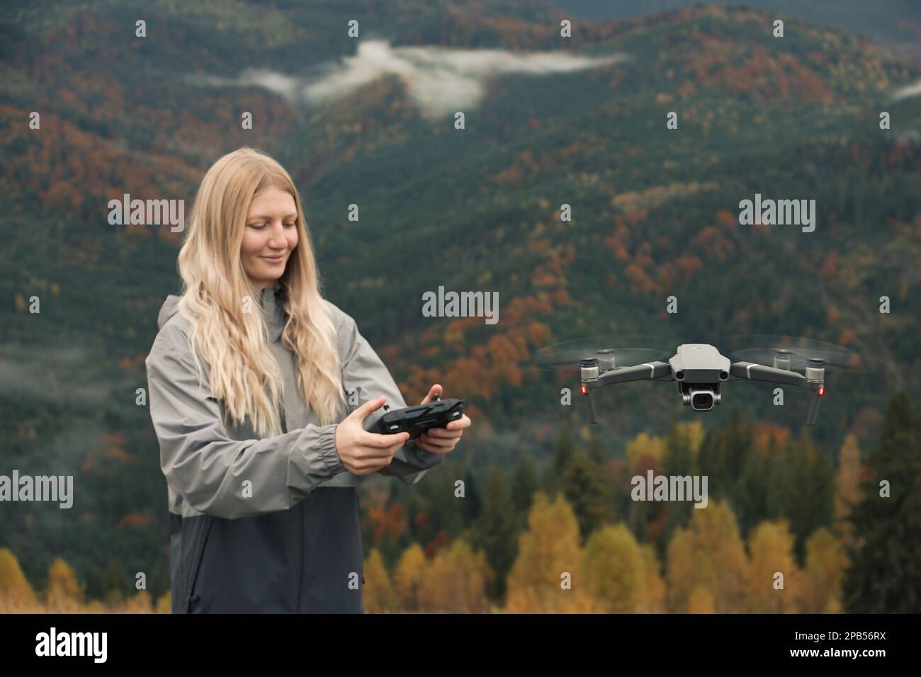 Operating drone in mountains hi-res stock photography and images - Alamy