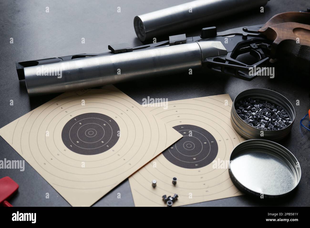 Composition with sport pistol on black table. Professional gun Stock ...
