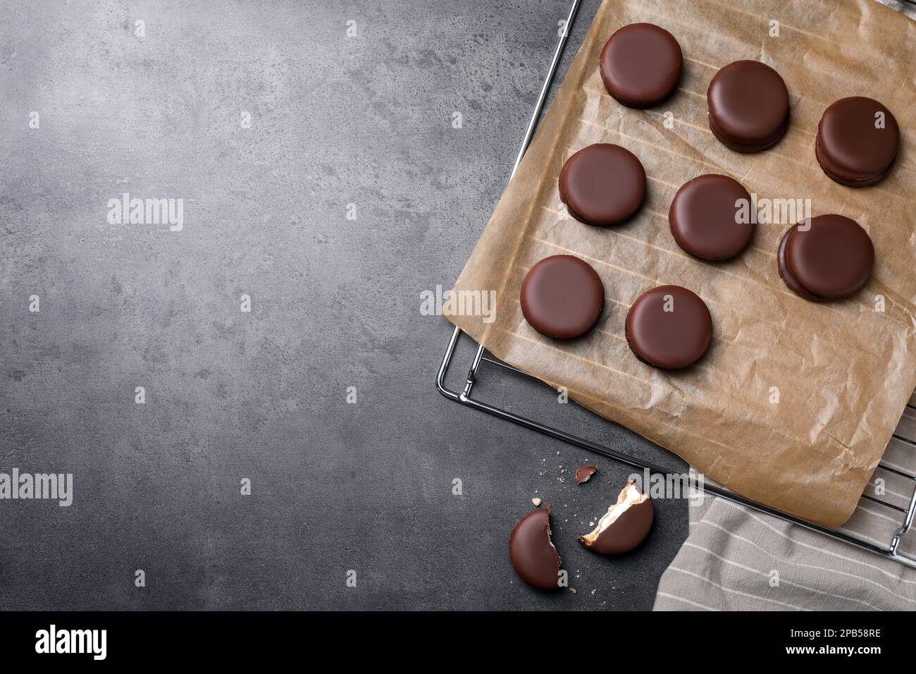 Tasty choco pies on grey table, flat lay. Space for text Stock Photo ...