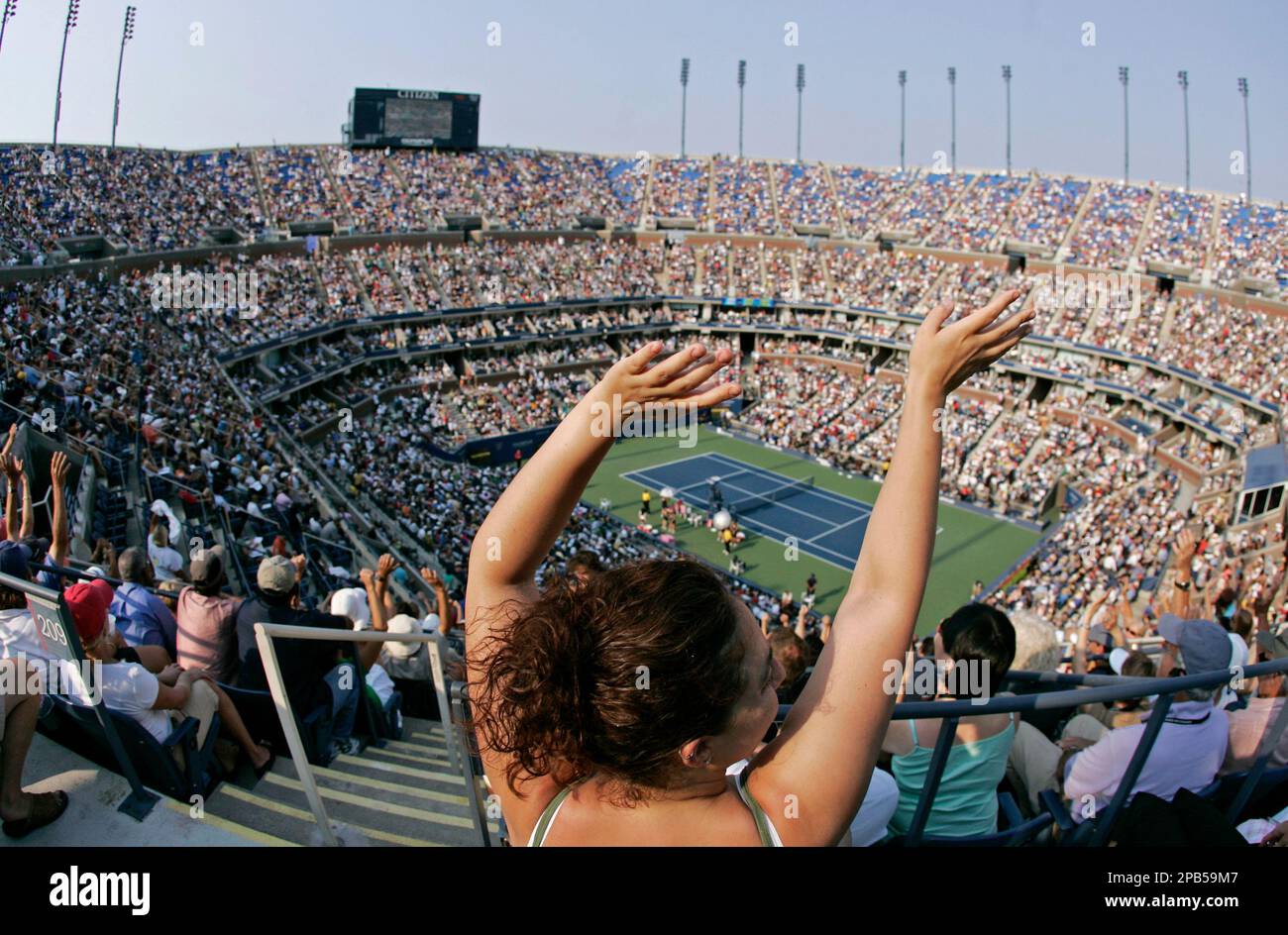 A spectator waves during the semifinal match between Venus Williams of ...