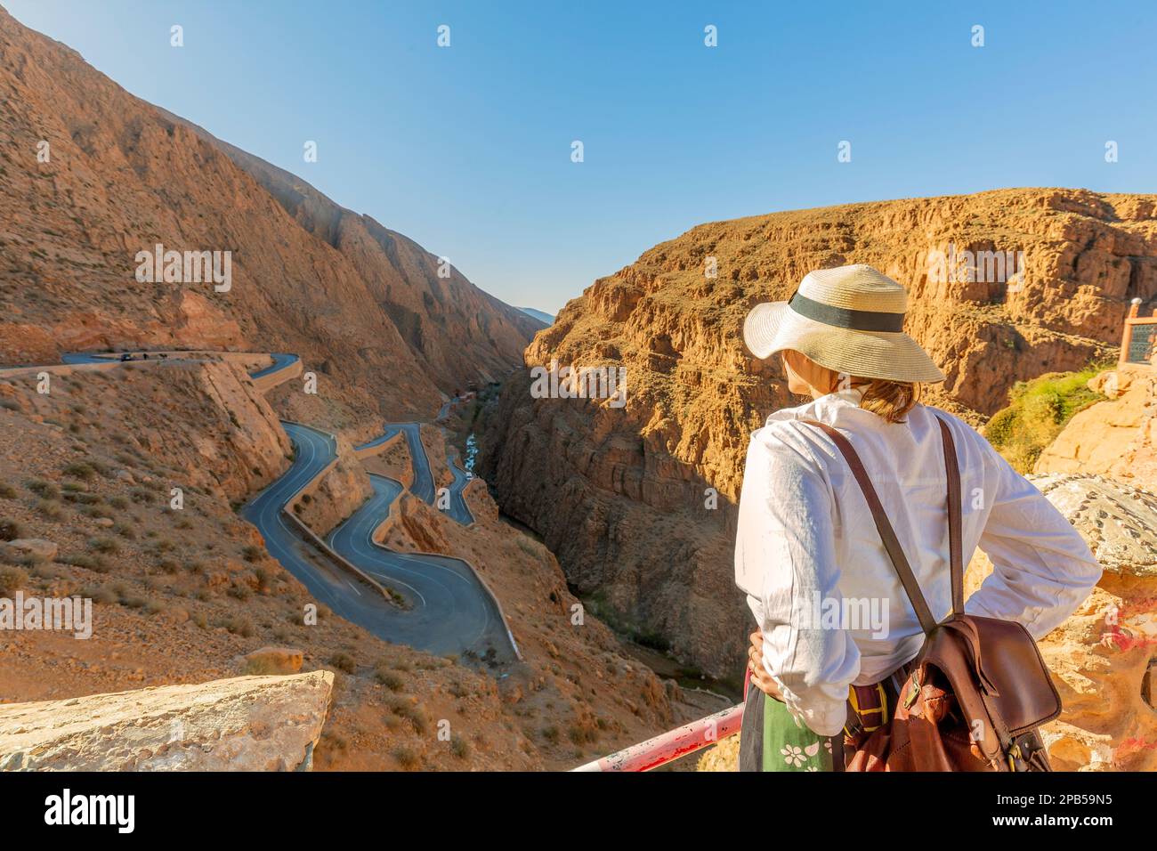 Young tourist looking at the dades gorge road. is a gorge of the Dades ...