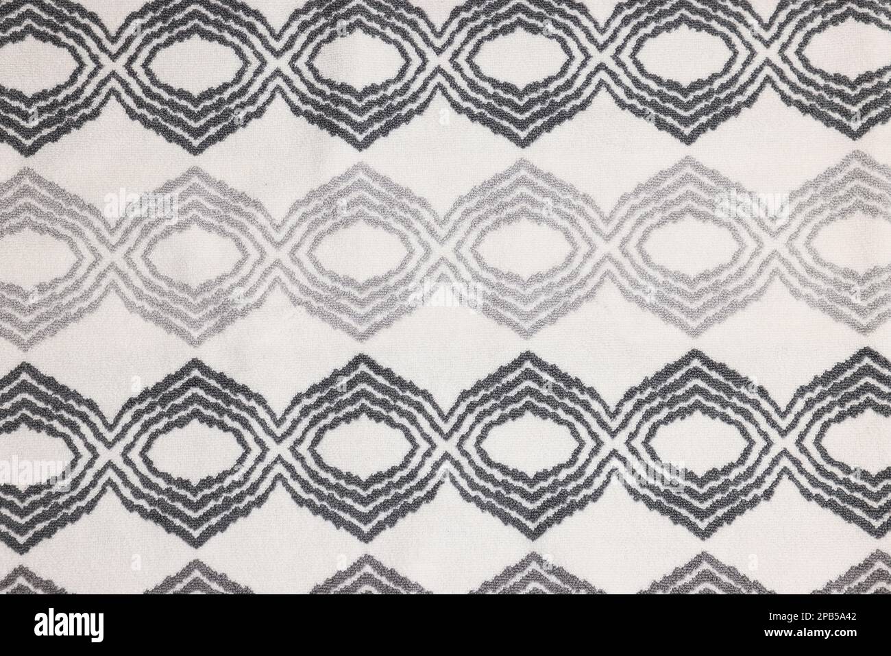 Soft bath mat with pattern as background, top view Stock Photo - Alamy