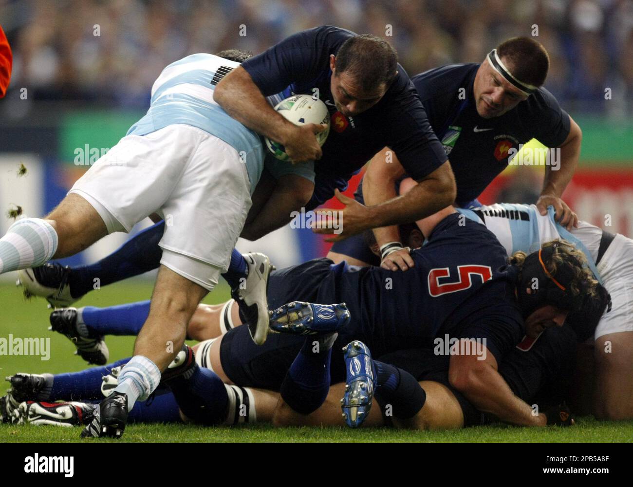 France's Raphael Ibanez, center with ball, is lifted up by Argentina's ...