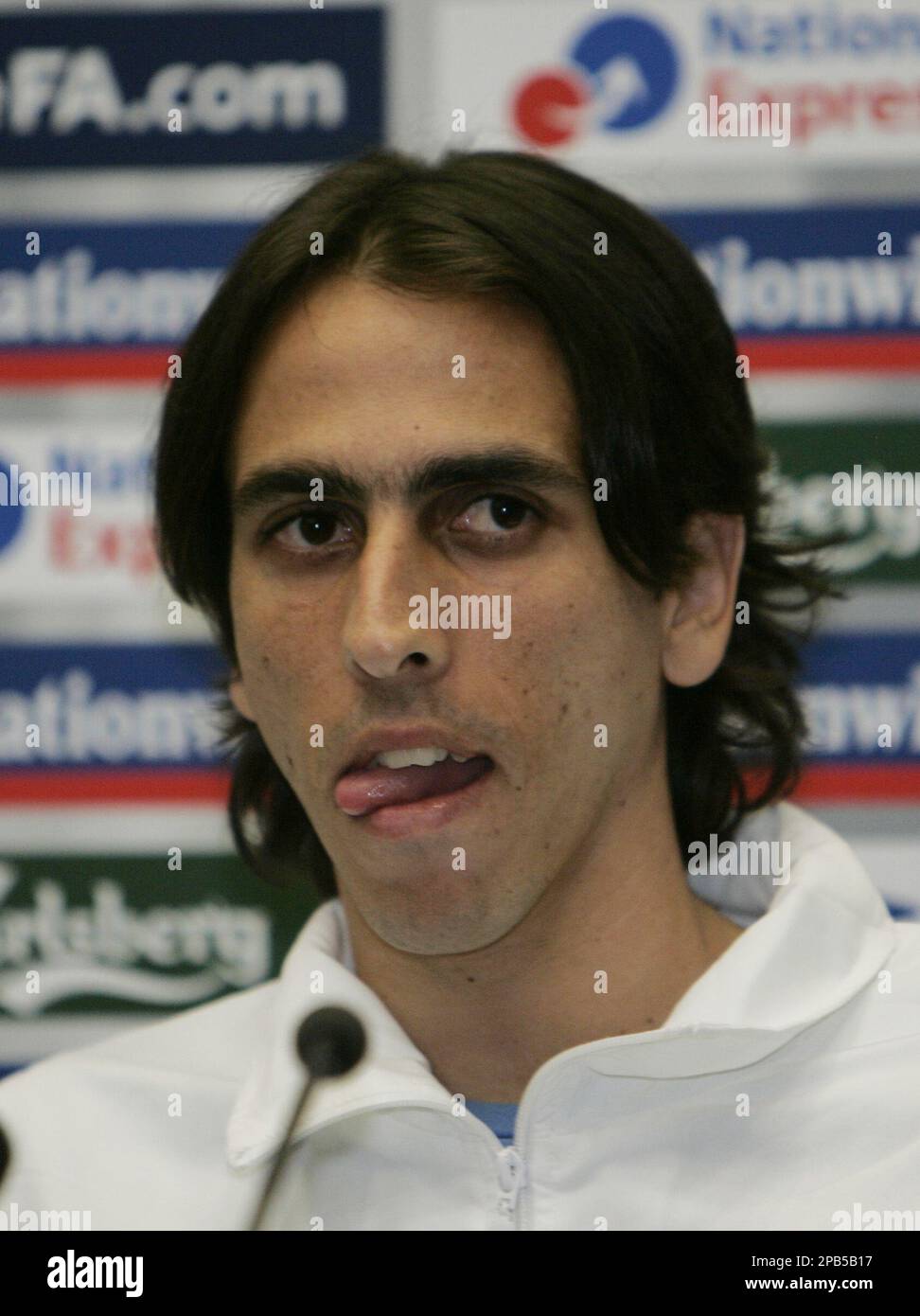 Liverpool's and Israel's soccer team player Yossi Benayoun answers a ...