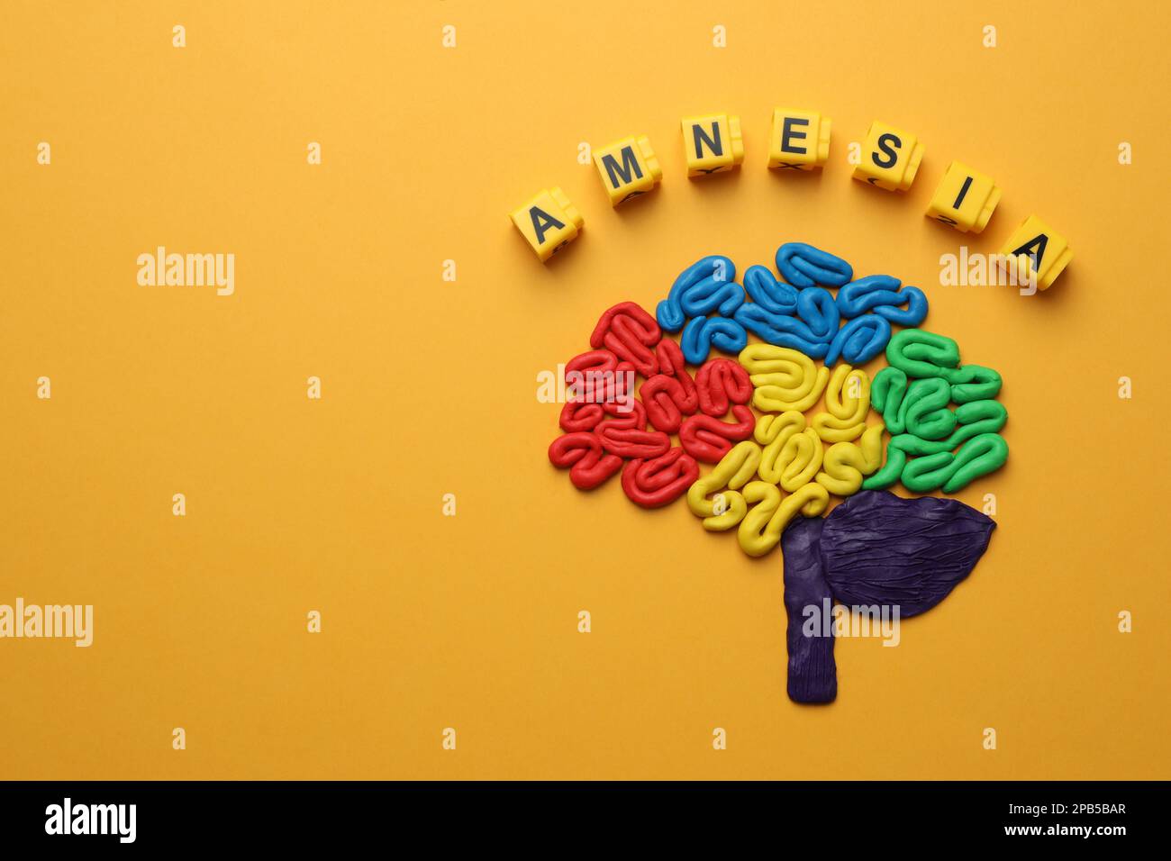 Cubes with word Amnesia and human brain made of colorful plasticine on ...