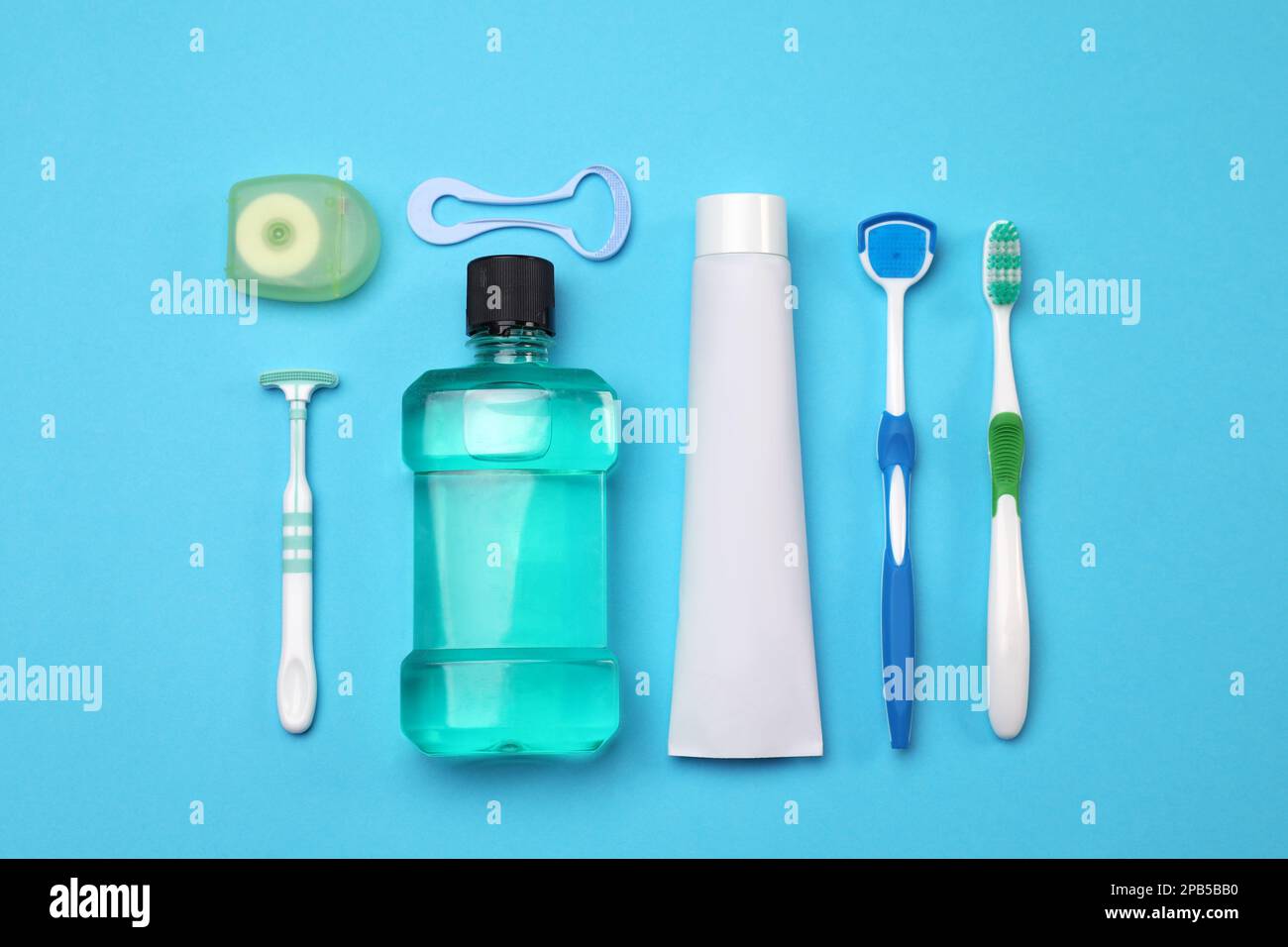 Flat lay composition with tongue cleaners and teeth care products on ...