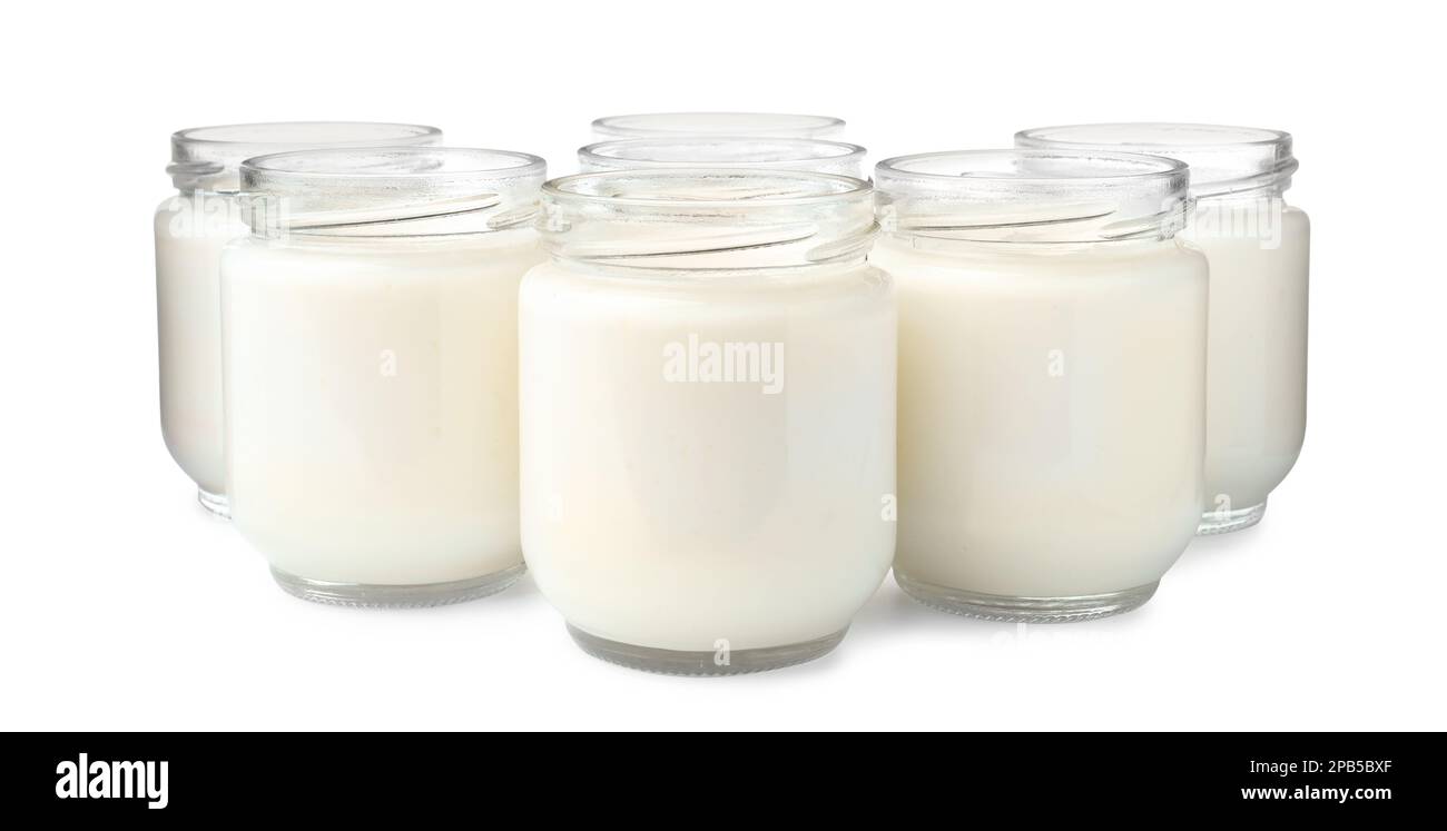 Glass jars with delicious homemade yogurt on white background Stock ...