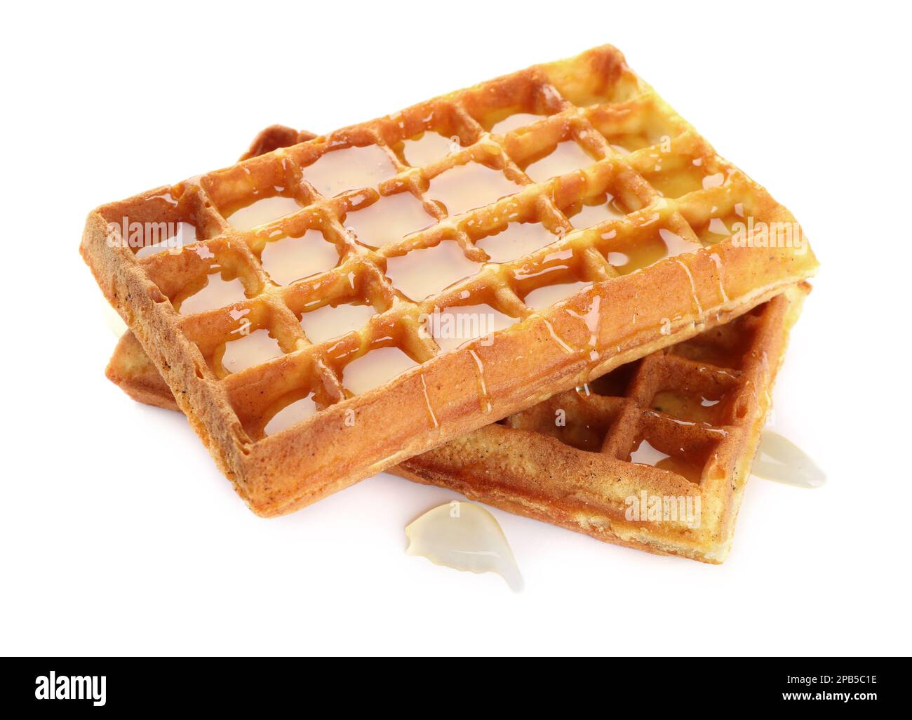 Two delicious Belgian waffles with honey on white background Stock ...