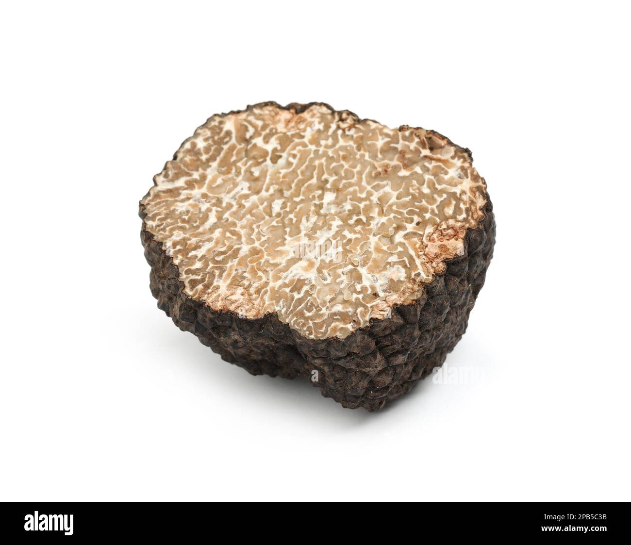 Cut fresh black truffle isolated on white Stock Photo - Alamy