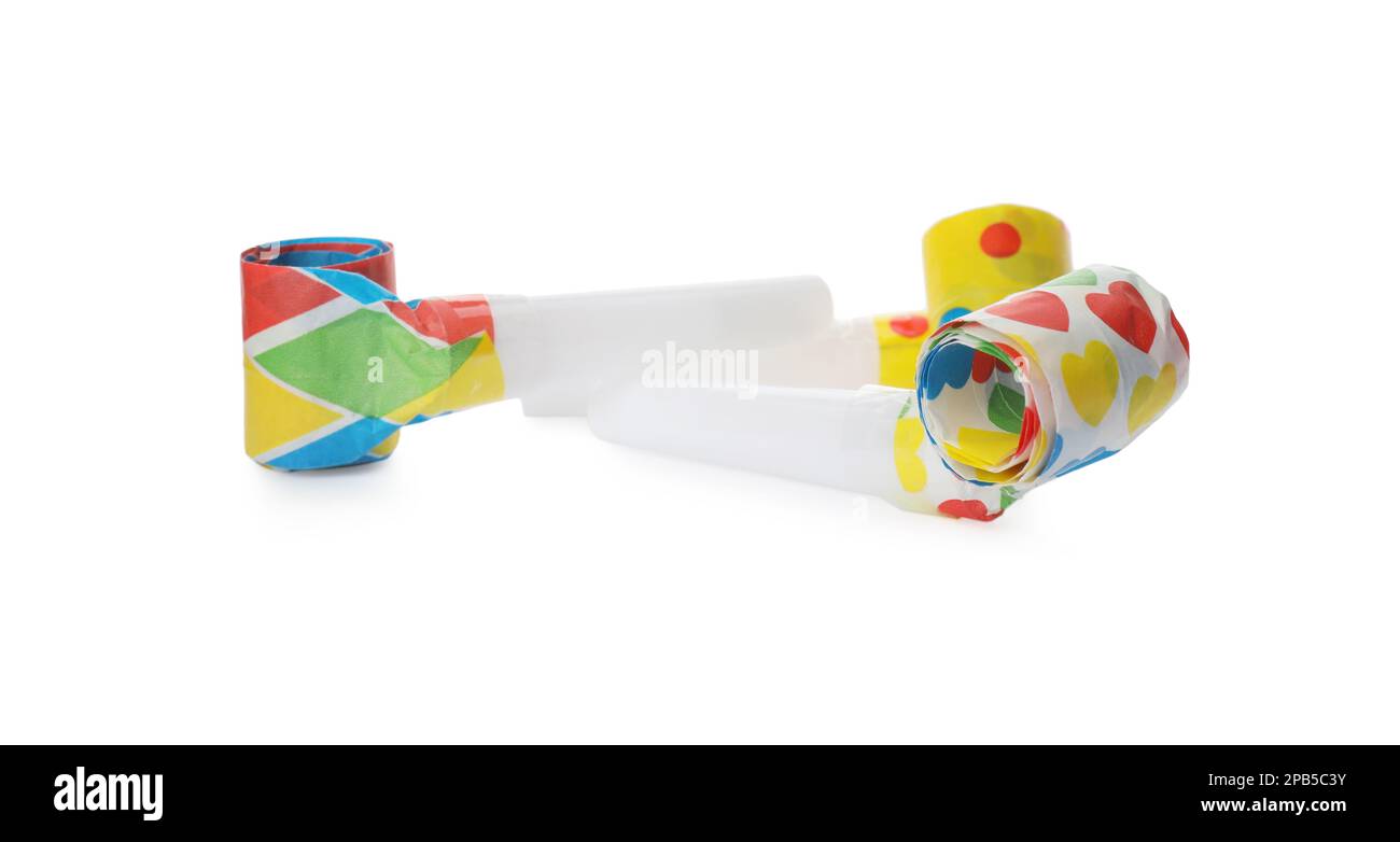 Bright party blowers on white background. Festive items Stock Photo - Alamy