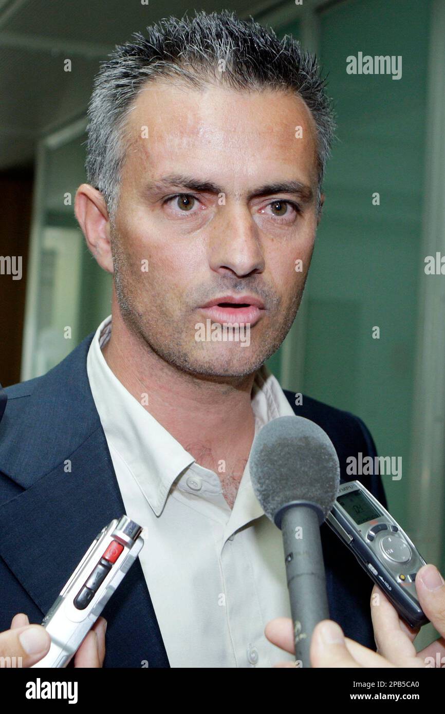 FC Chelsea's coach Jose Mourinho, left, answers reporters after the 9th ...
