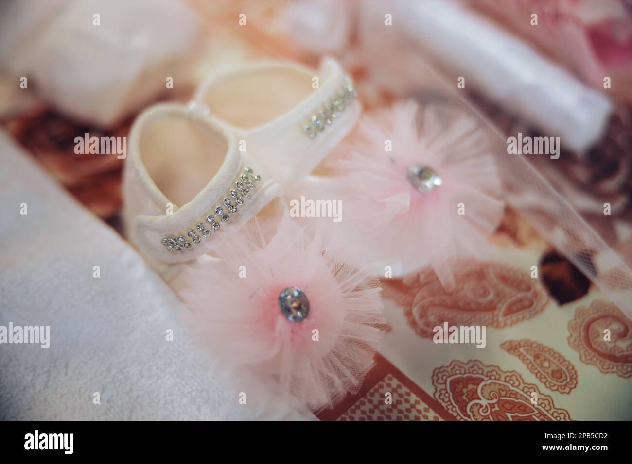 Baby pink shoes set up for a child's orthodox baptism religious ritual. High quality photo Stock ...