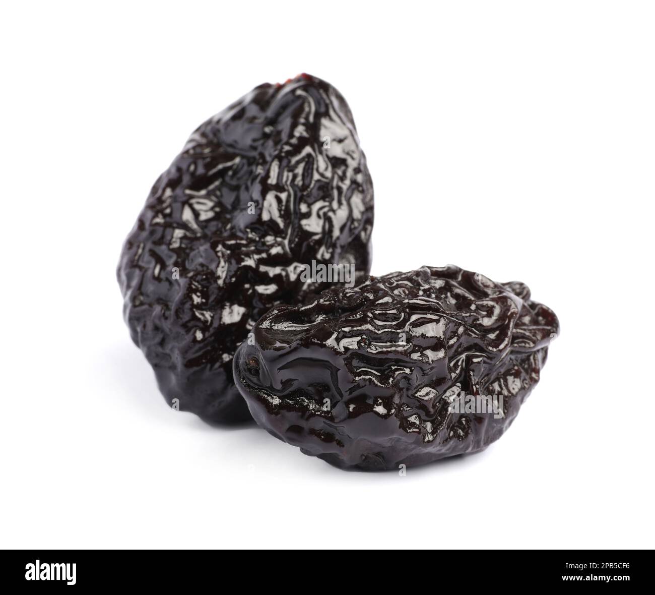 Sweet dried prunes on white background. Healthy snack Stock Photo - Alamy