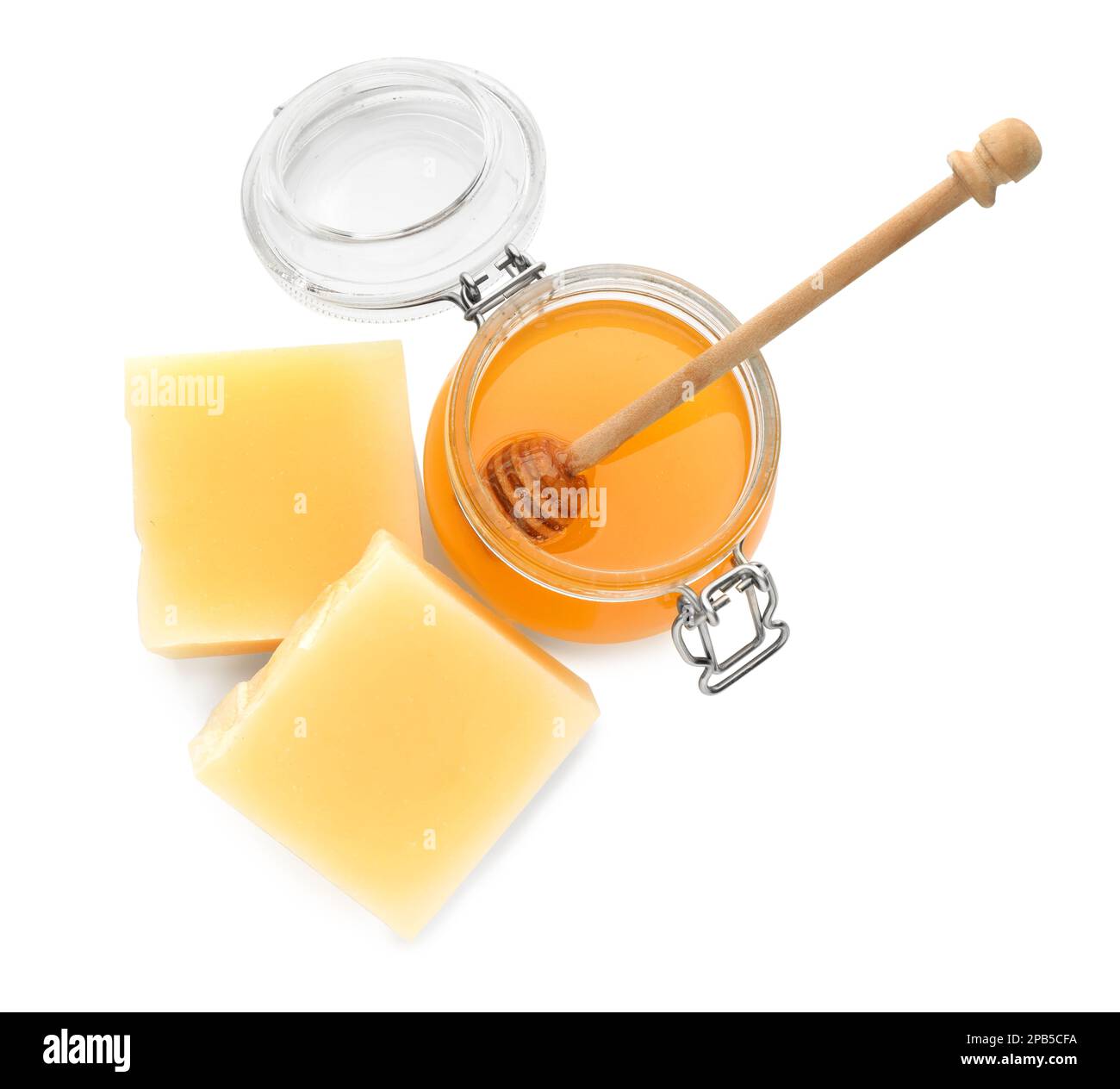 Honey and natural beeswax on white background, top view Stock Photo - Alamy