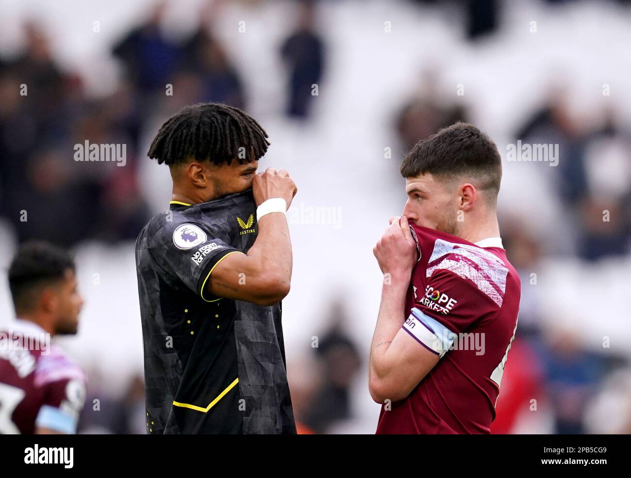 Aston Villa's Tyrone Mings (left) speaks to West Ham United's Declan ...