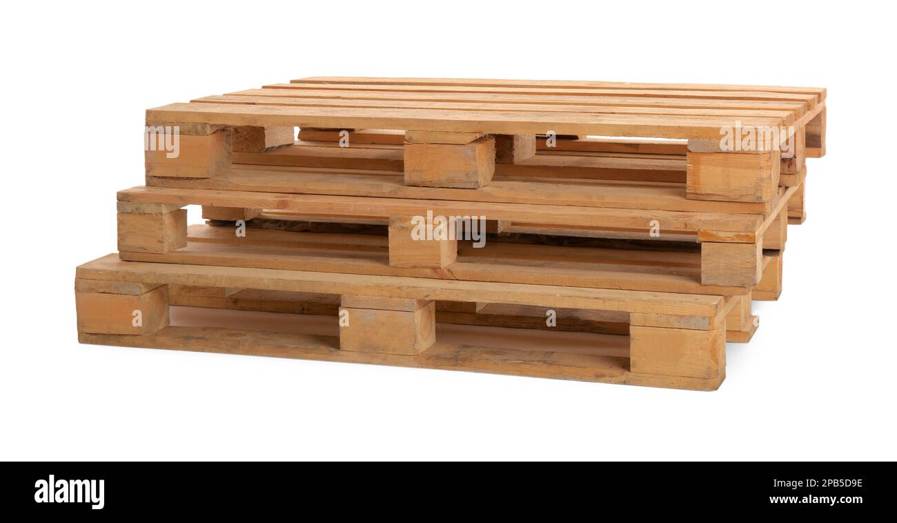 Stacked wooden pallets isolated on white. Transportation and storage ...