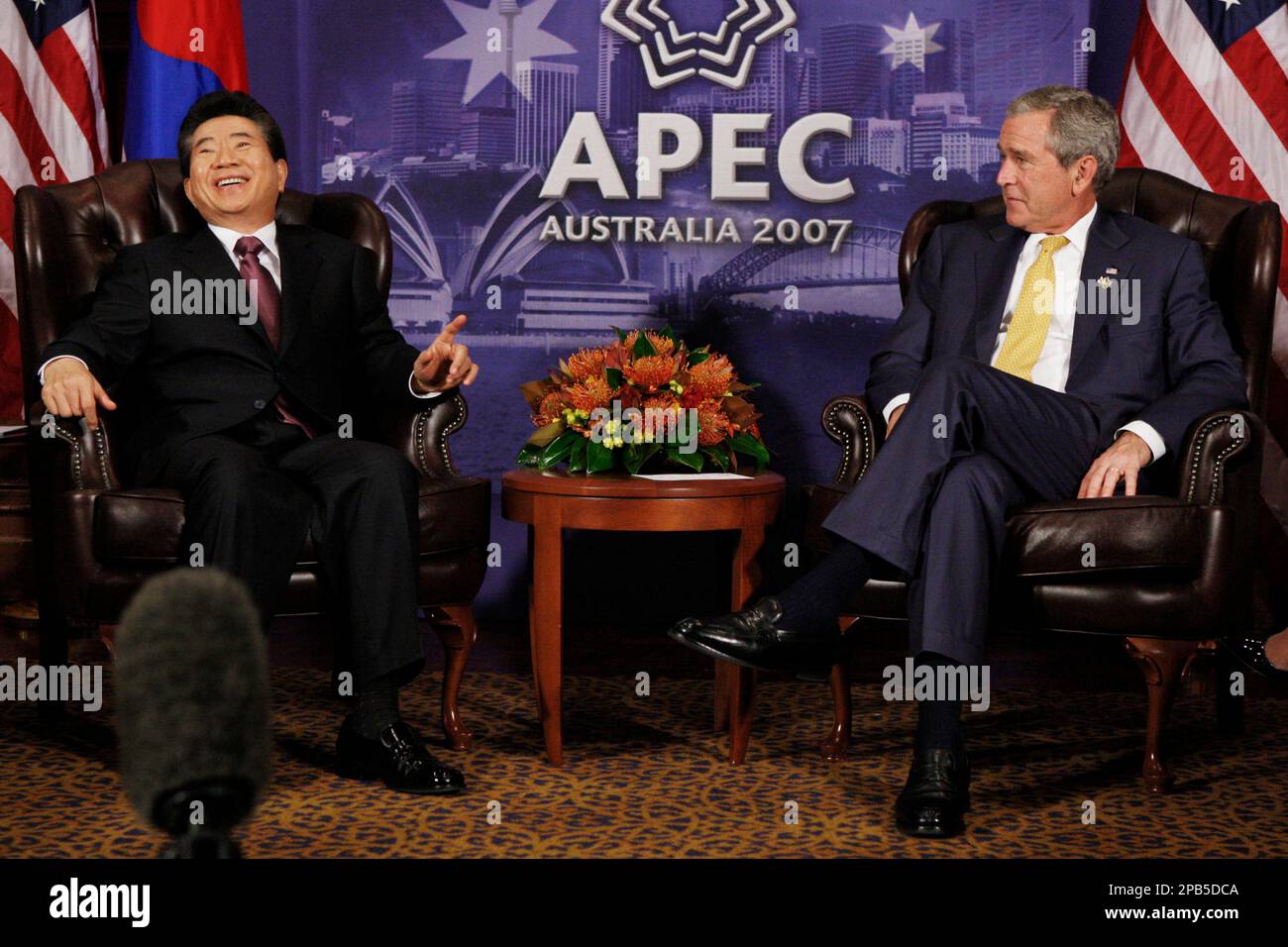 President Bush, right, looks on as South Korean President Roh Moo-hyun ...