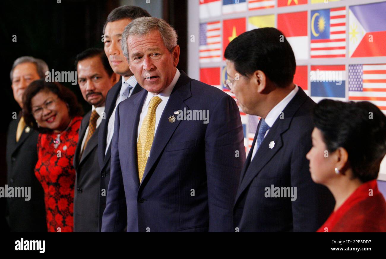 President Bush, center, makes a statement after his meeting with ...