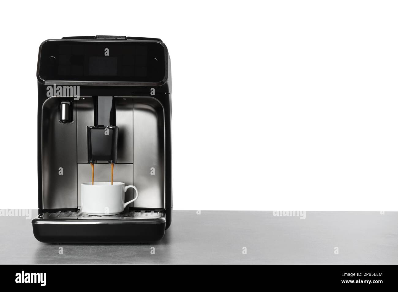 Making coffee with modern espresso machine on table against white ...