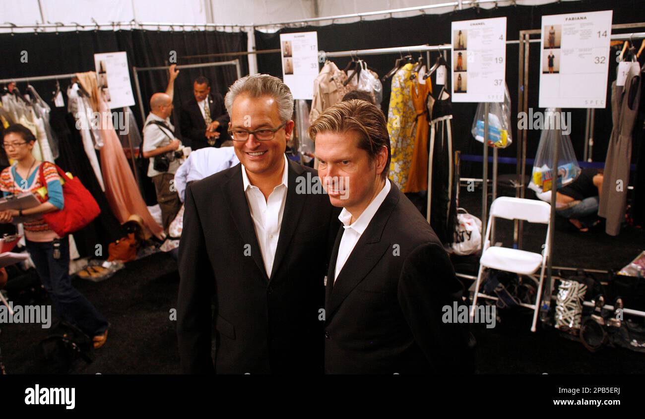 Designers Mark Badgley, left, and James Mischka give an interview ...