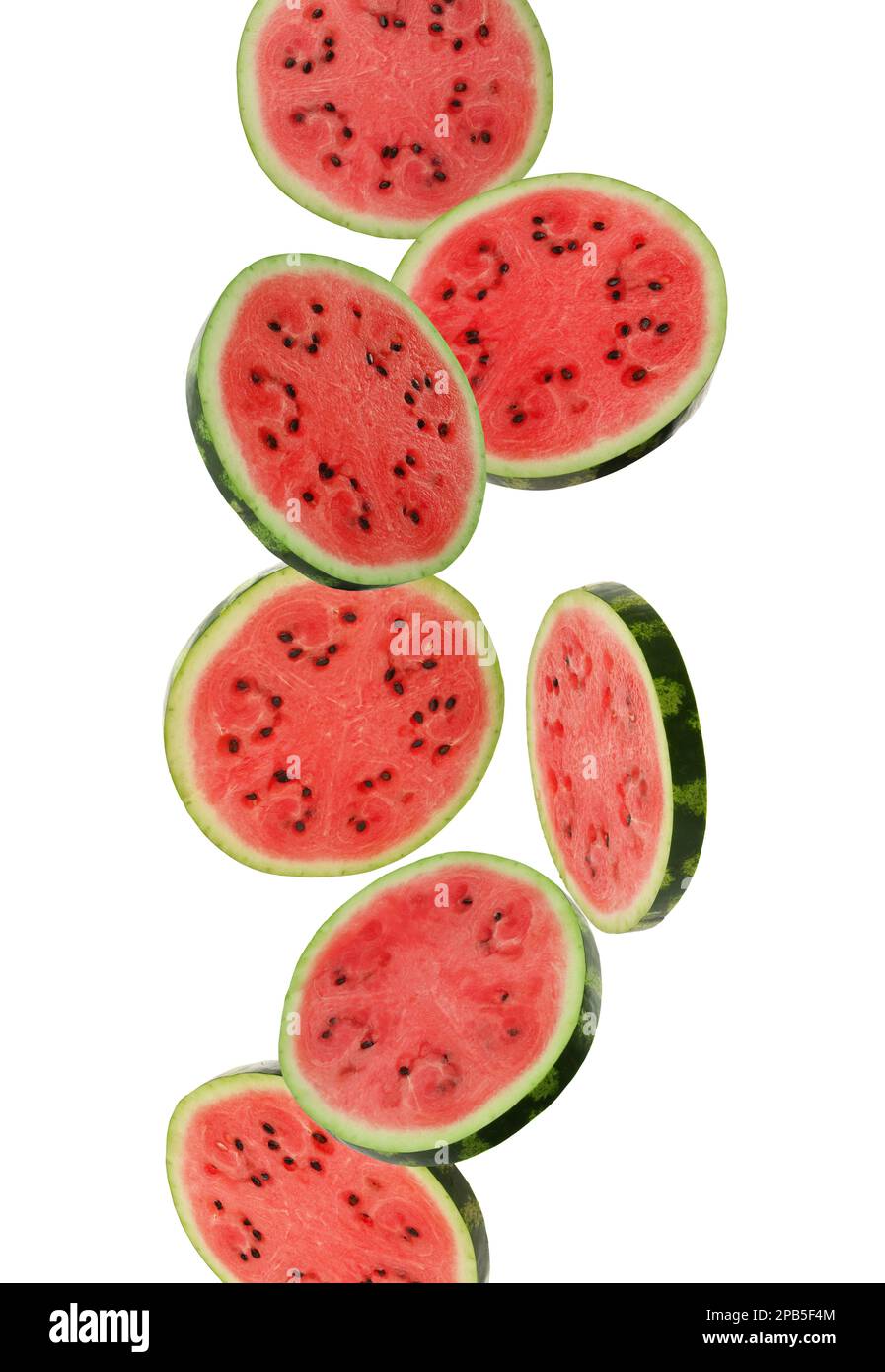 Slices of delicious ripe watermelon falling on white background Stock ...