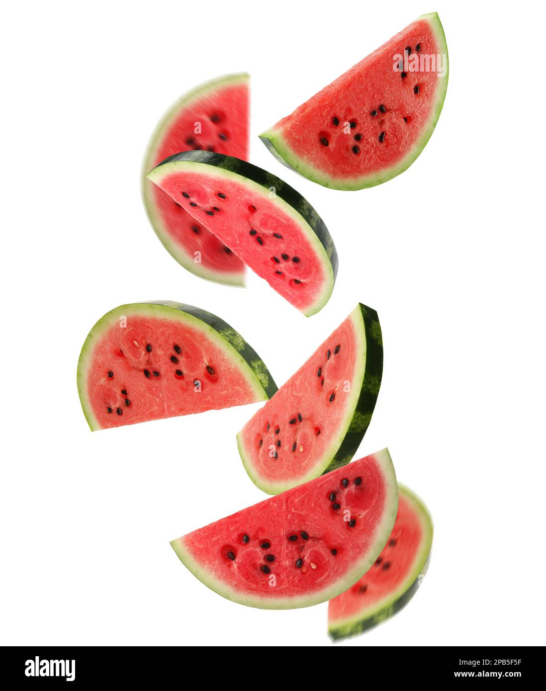 Slices of delicious ripe watermelon falling on white background Stock ...
