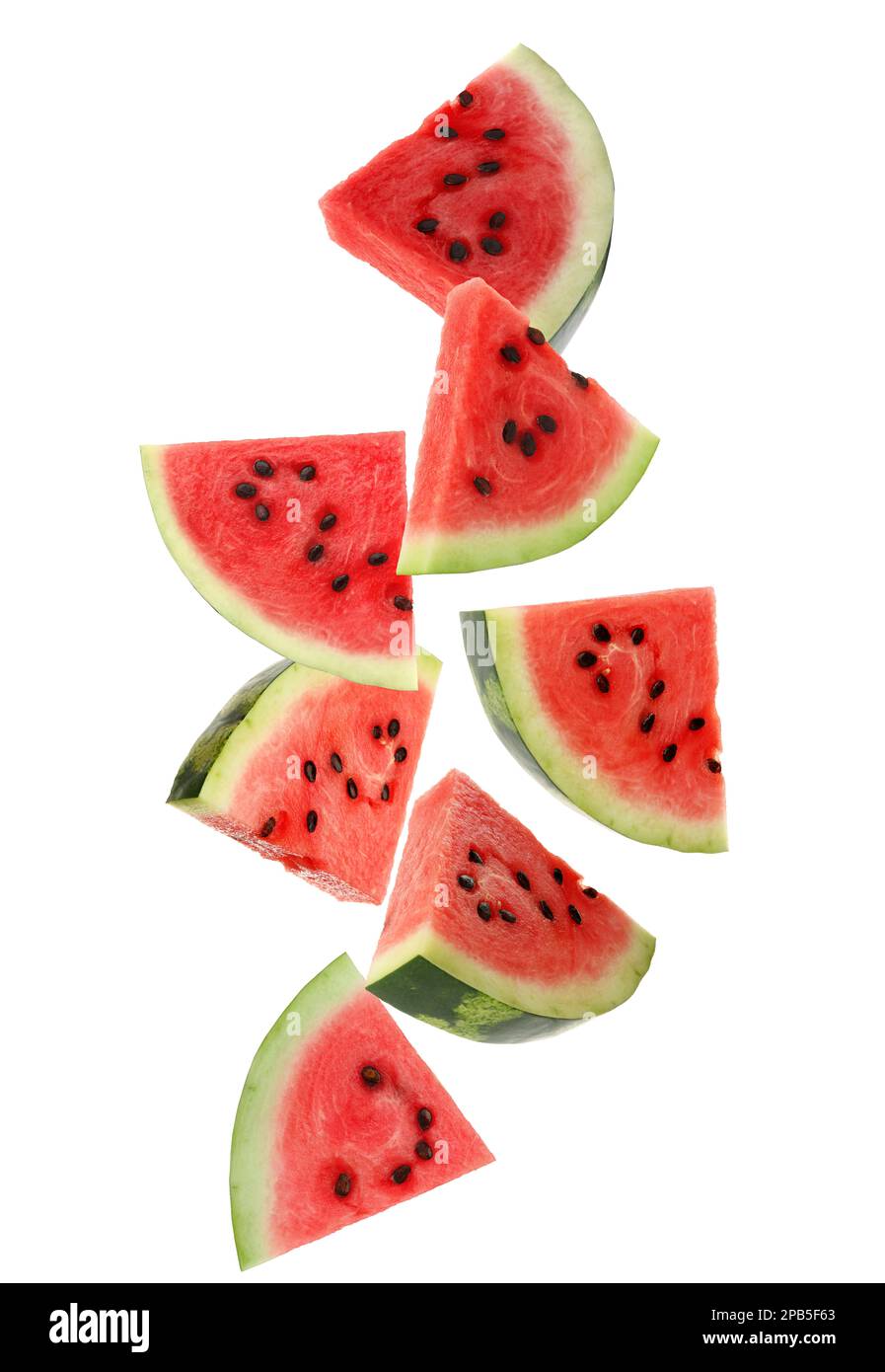 Slices of delicious ripe watermelon falling on white background Stock ...